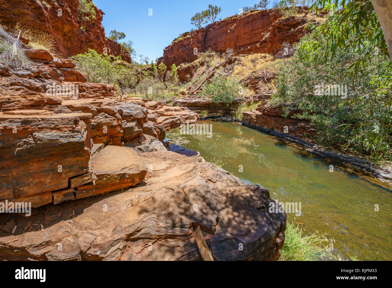 hiking down in the deep and narrow weano gorge in karijini national ...