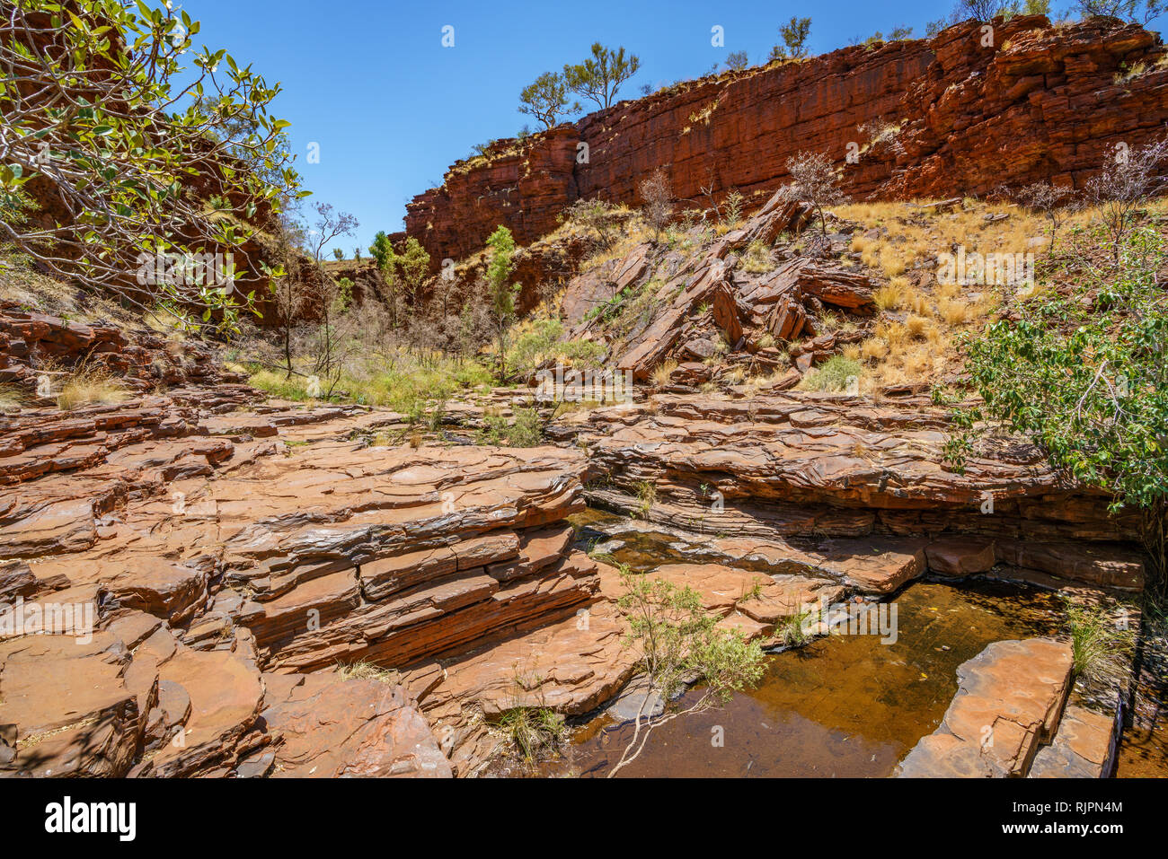 hiking down in the deep and narrow weano gorge in karijini national ...