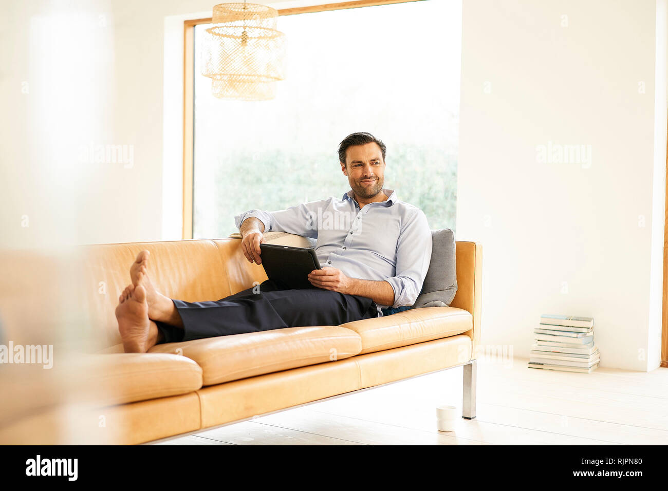 Reclining man hi-res stock photography and images - Alamy