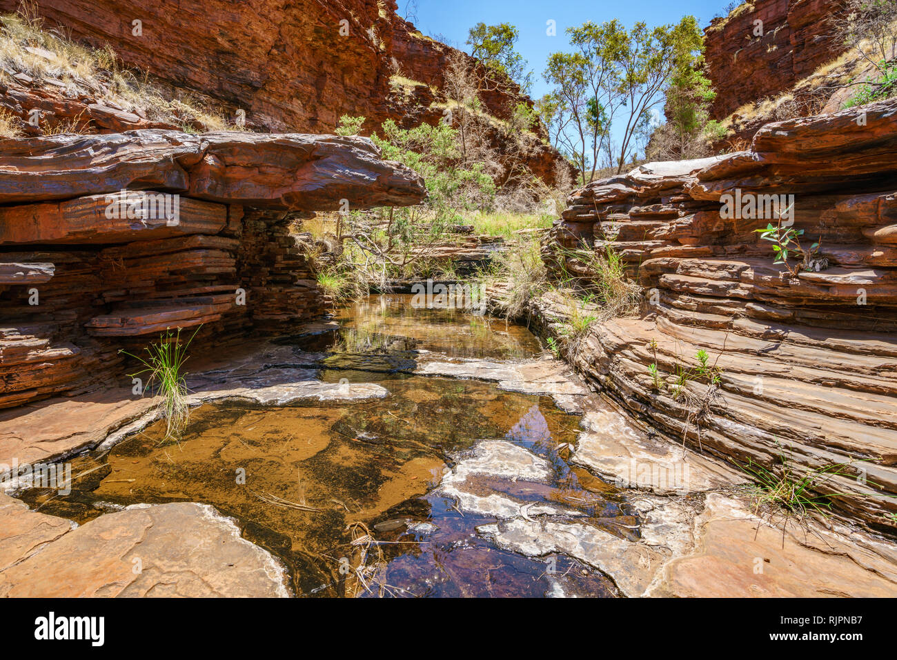 hiking down in the deep and narrow weano gorge in karijini national ...