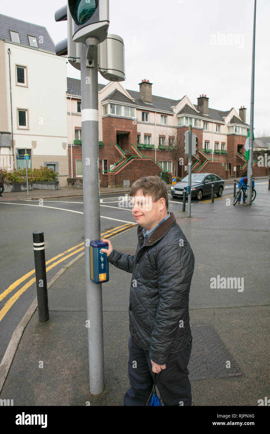 Man with down syndrome at pedestrian crossing, Galway, Ireland Stock ...