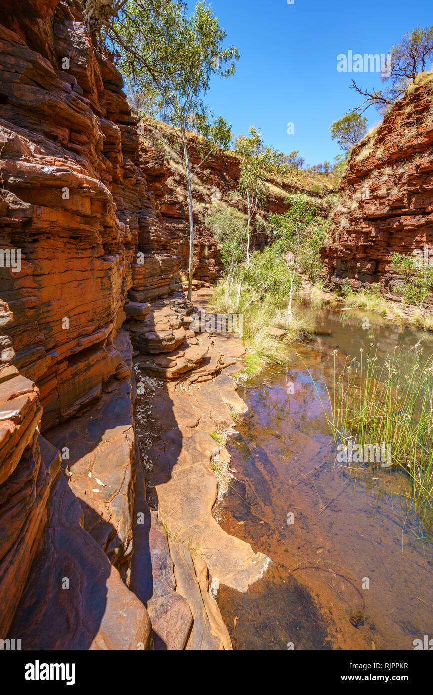 hiking down in steep hancock gorge in karijini national park, western ...