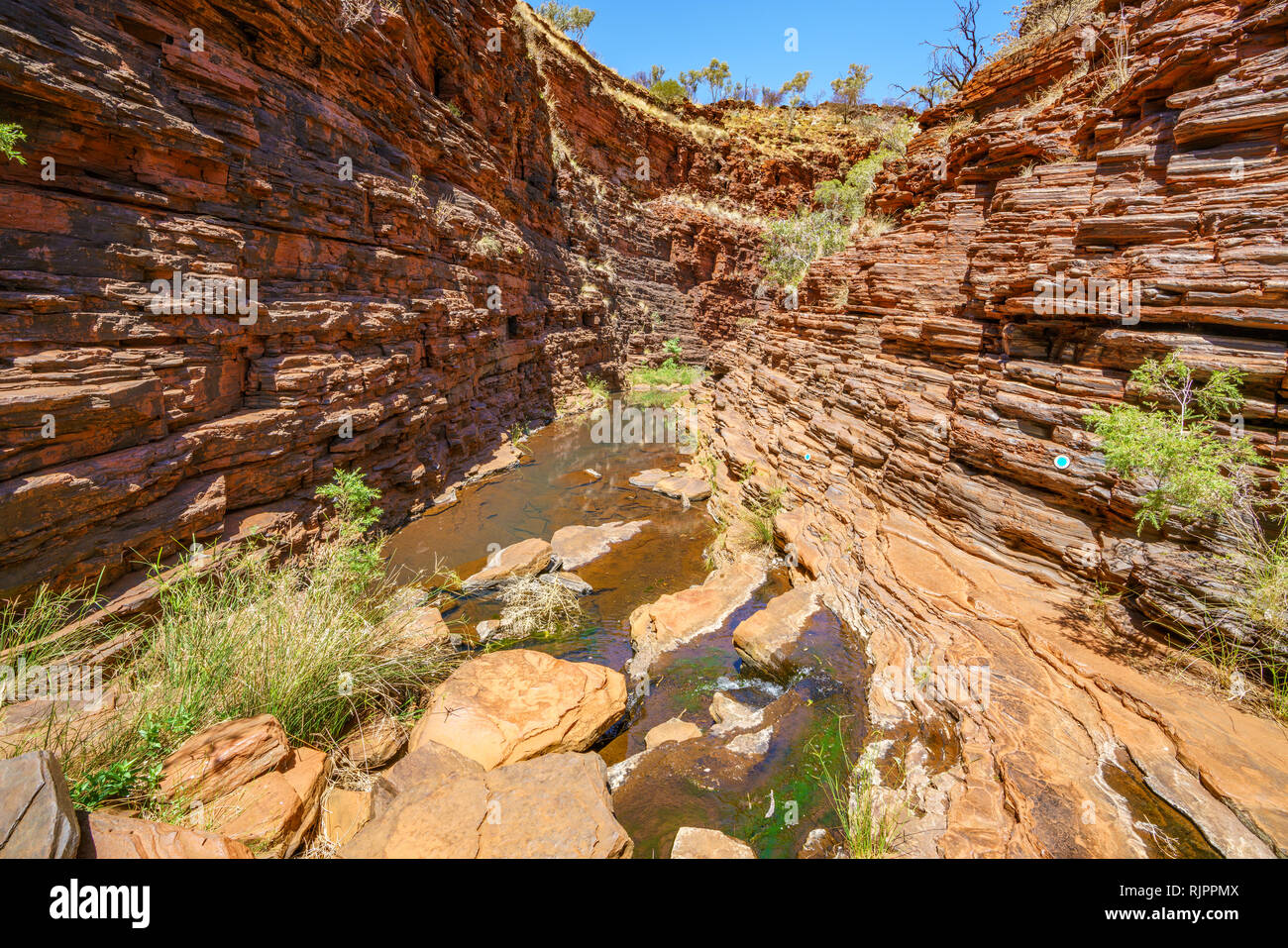 hiking down in steep hancock gorge in karijini national park, western ...