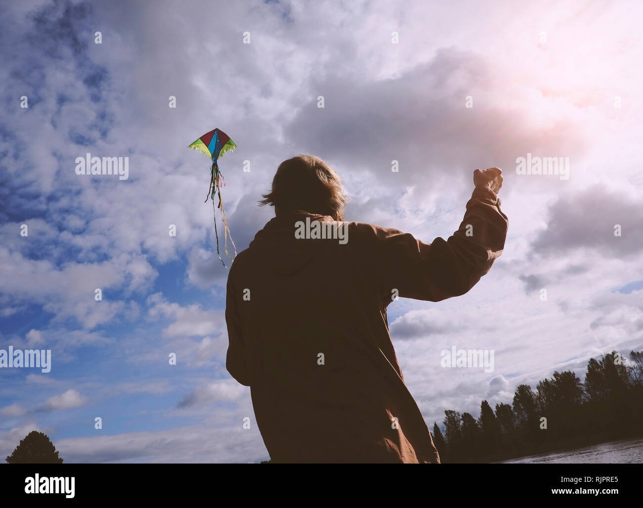 Kite flying on cloudy and windy day Stock Photo - Alamy