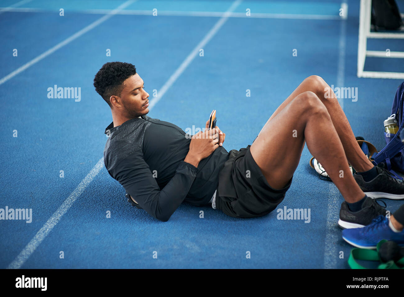 People running on indoor track hi-res stock photography and images - Alamy