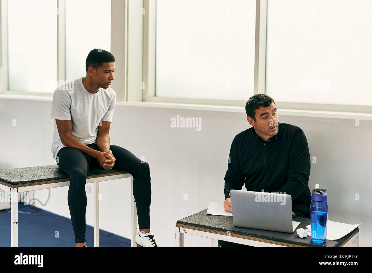 Coach with athlete hi-res stock photography and images - Alamy