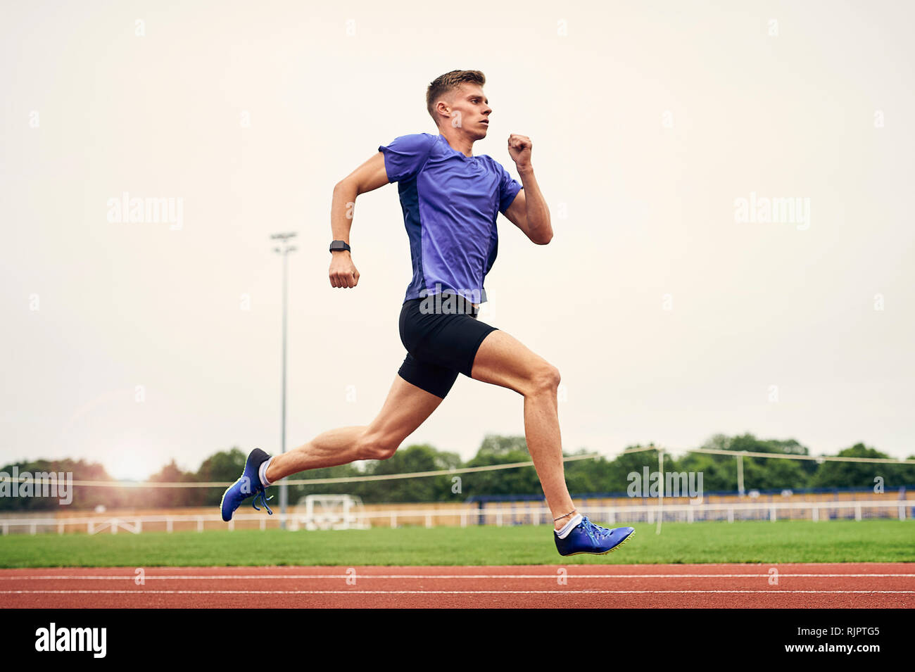 Runner training on running track Stock Photo - Alamy