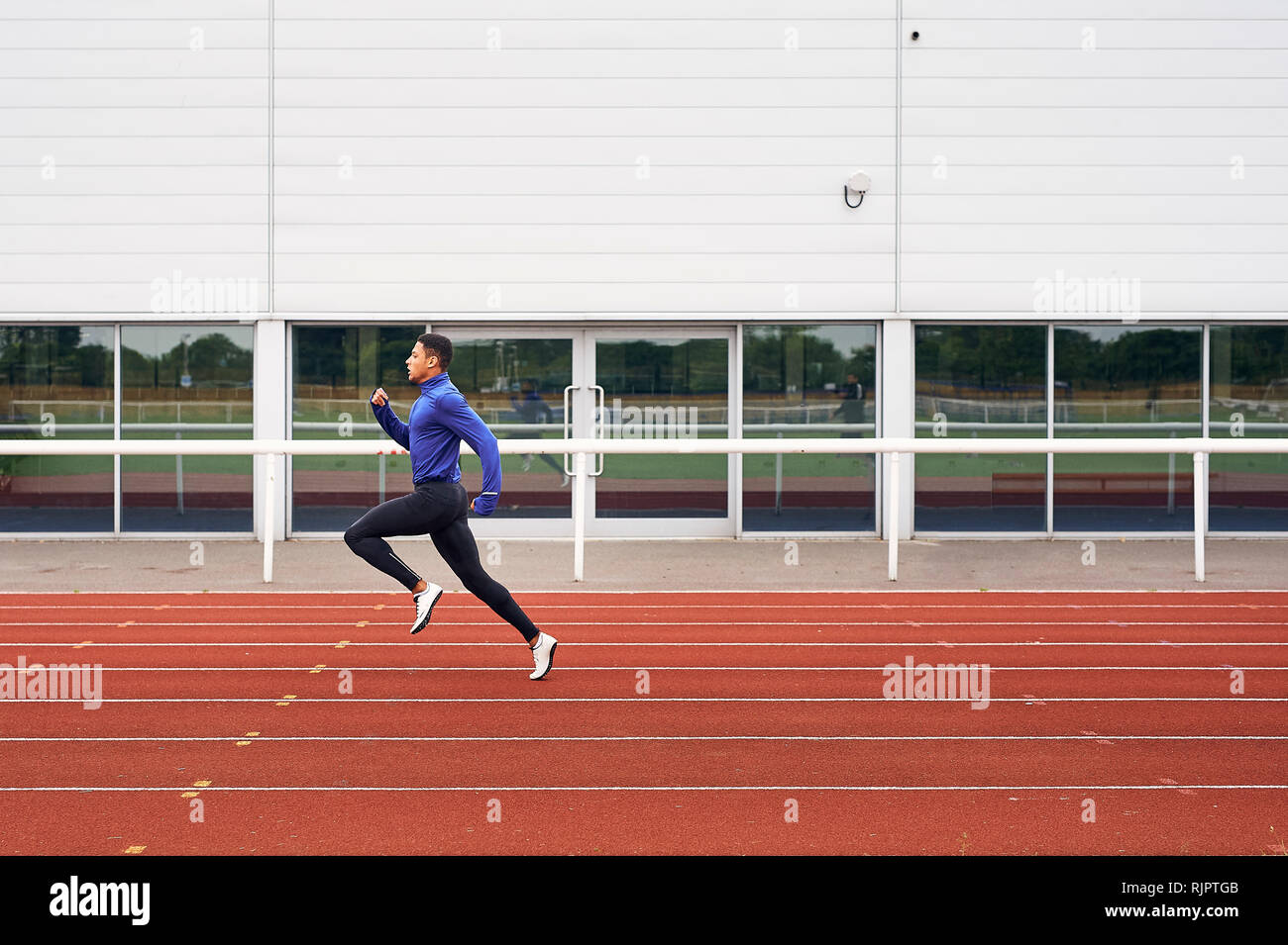 Runner training on running track Stock Photo - Alamy