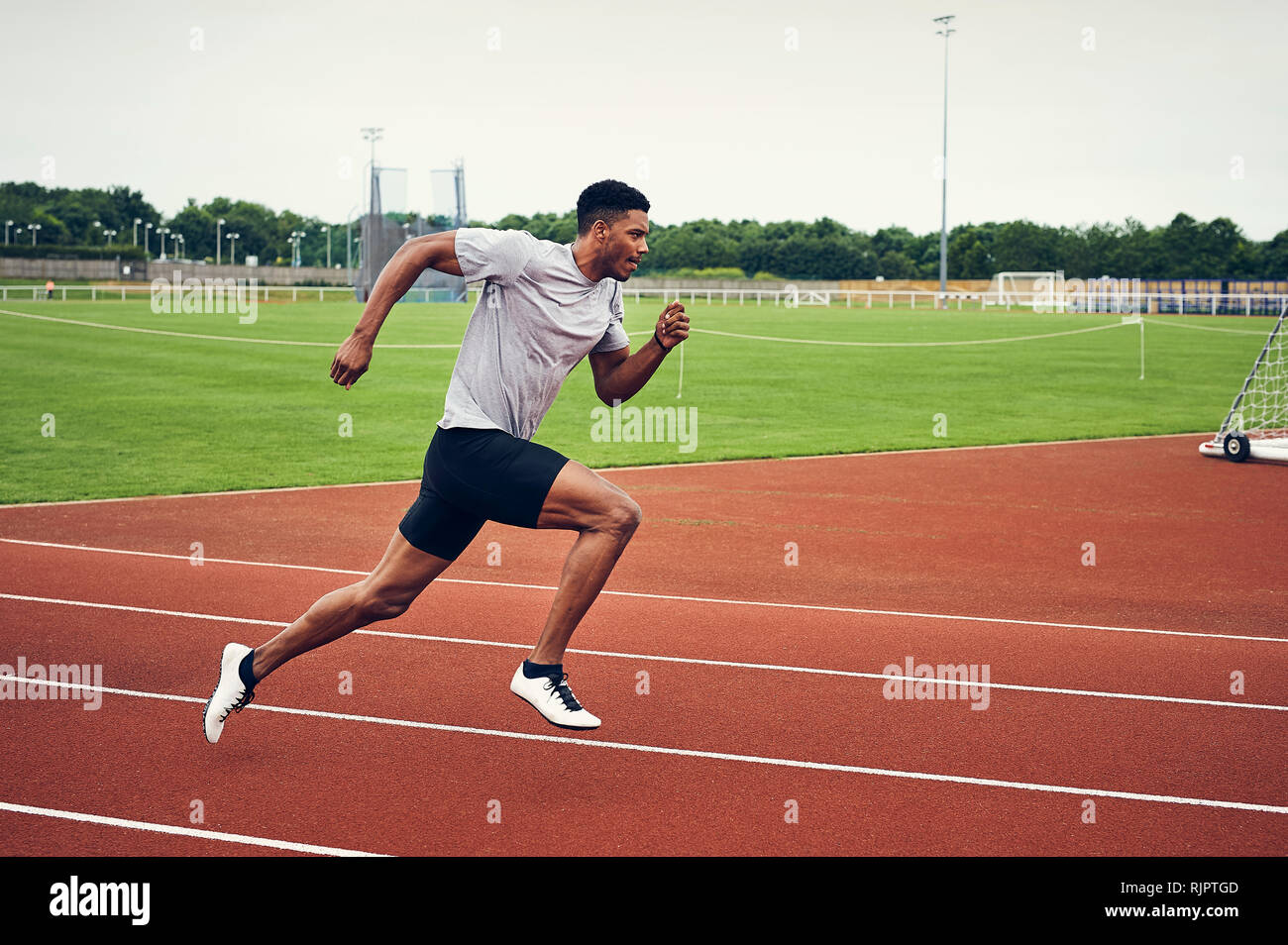 Runner training on running track Stock Photo - Alamy