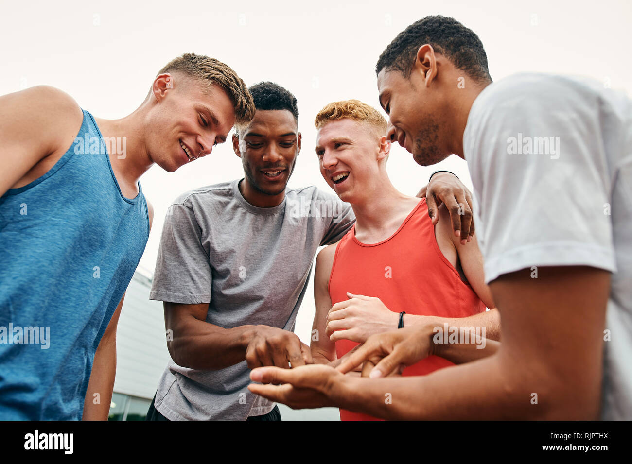Athlete friends enjoying conversation Stock Photo - Alamy