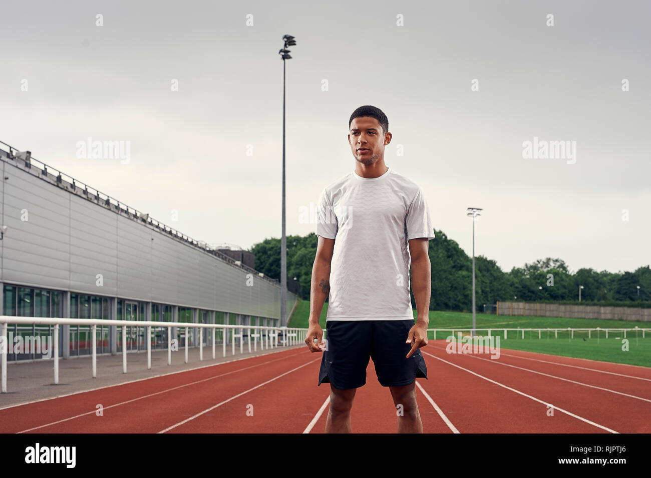 Portrait of athlete on running track Stock Photo - Alamy
