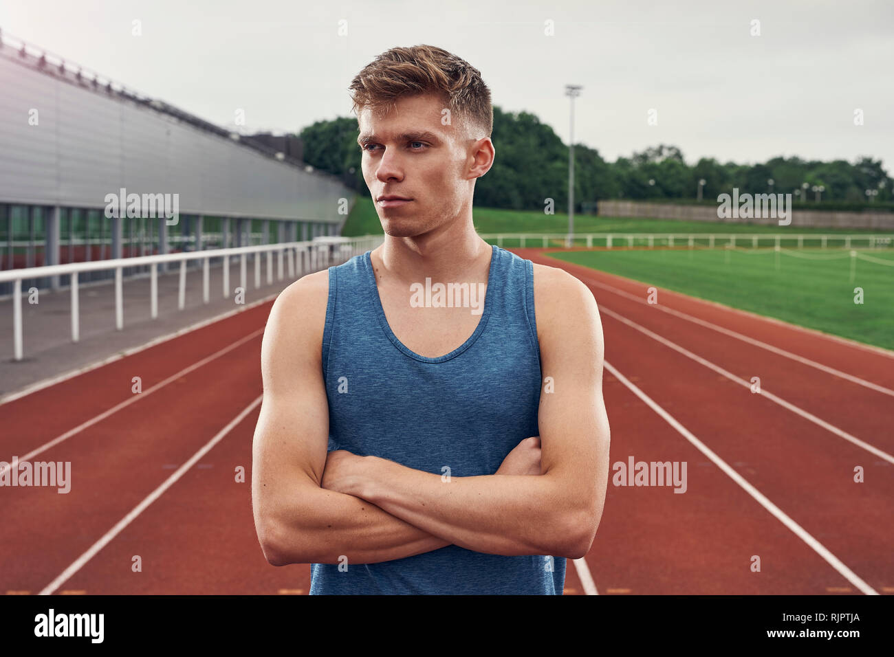 Portrait of athlete on running track Stock Photo - Alamy