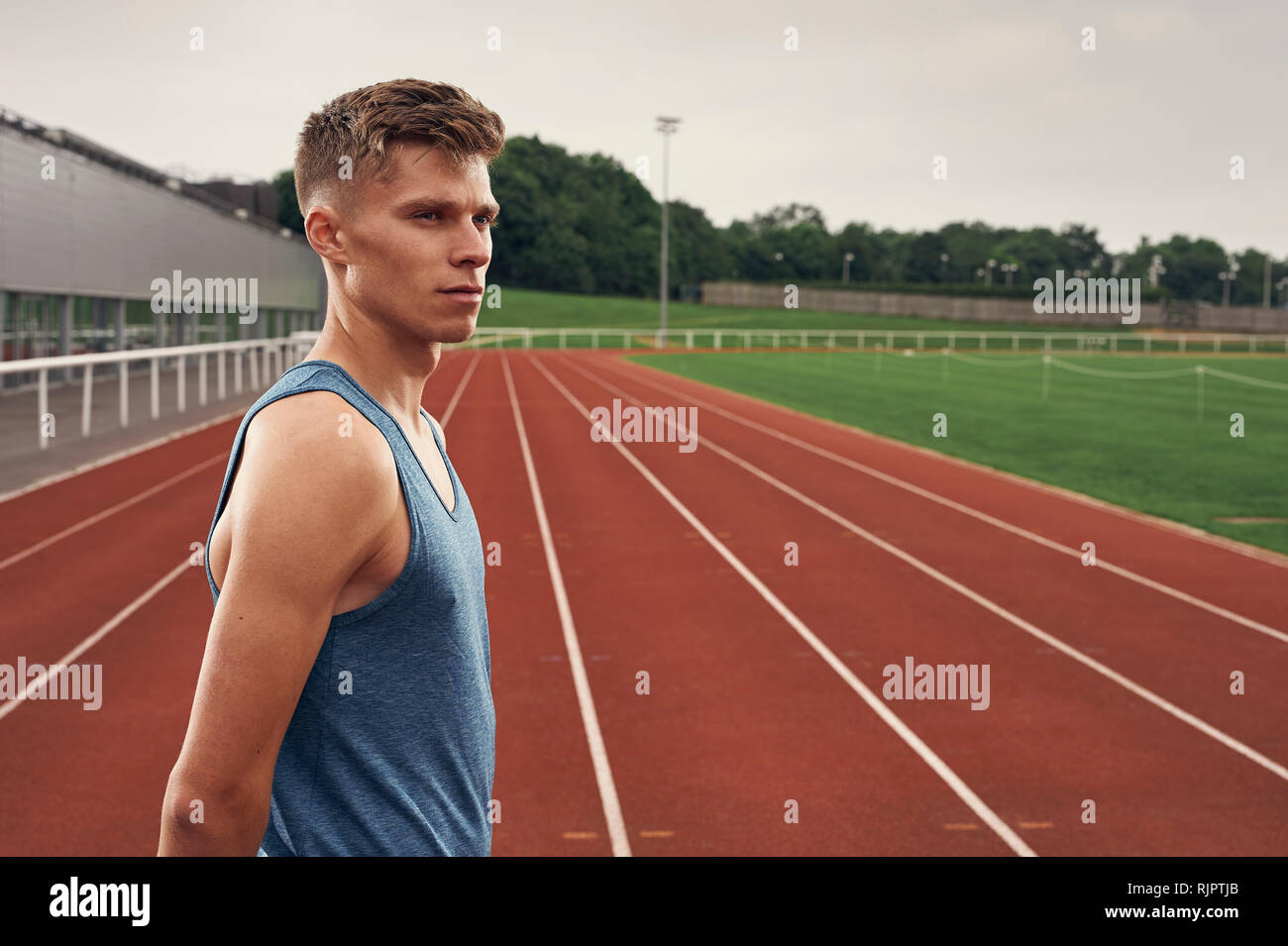Portrait of athlete on running track Stock Photo - Alamy