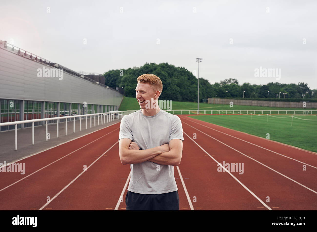 Portrait of athlete on running track Stock Photo - Alamy