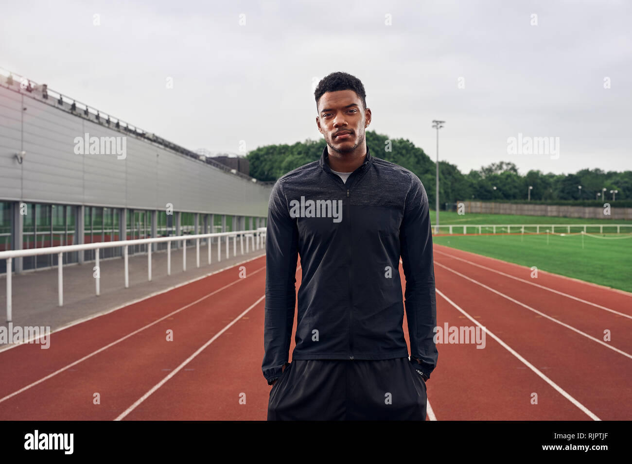 Portrait of athlete on running track Stock Photo - Alamy