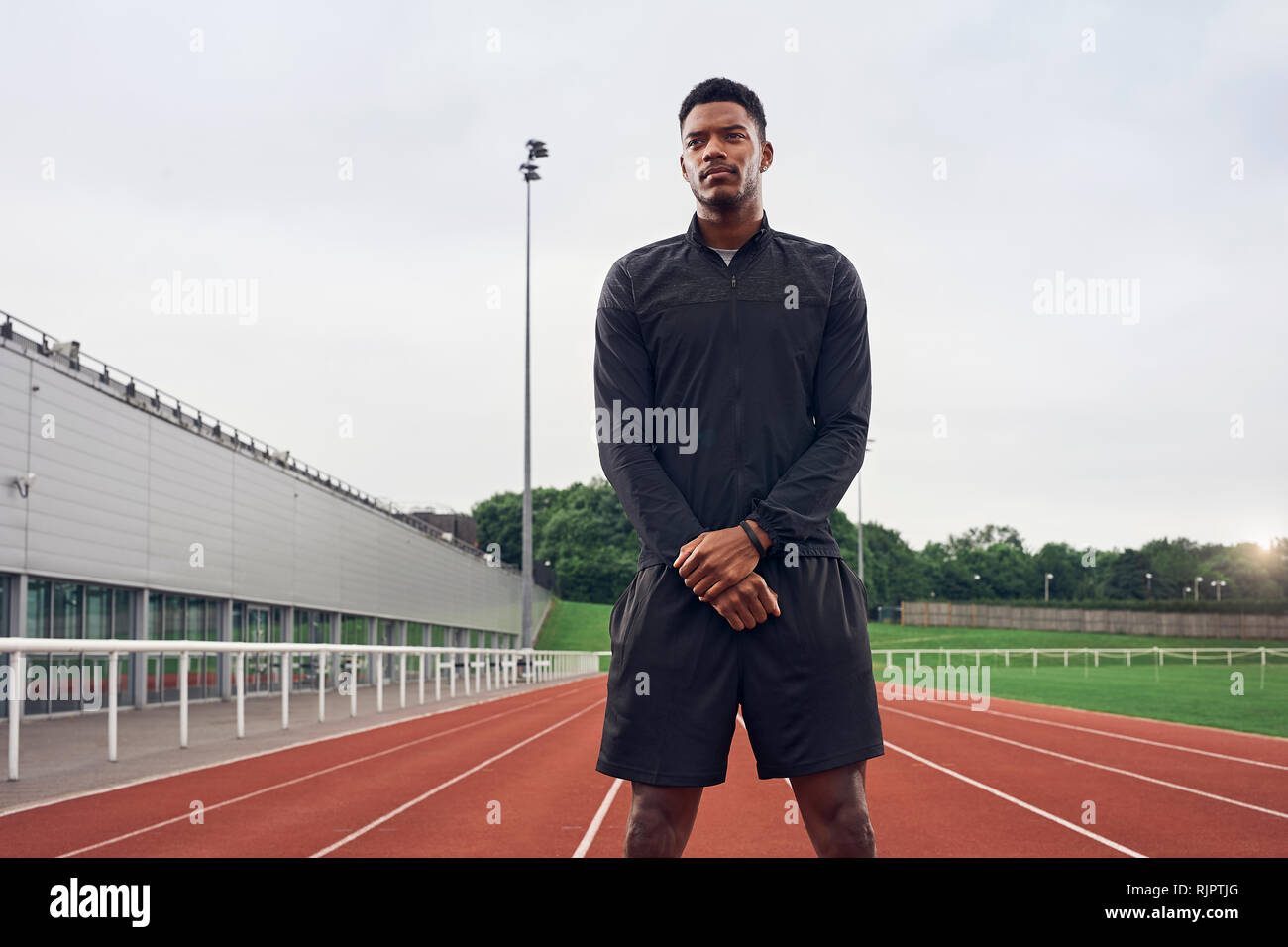 Portrait of athlete on running track Stock Photo - Alamy