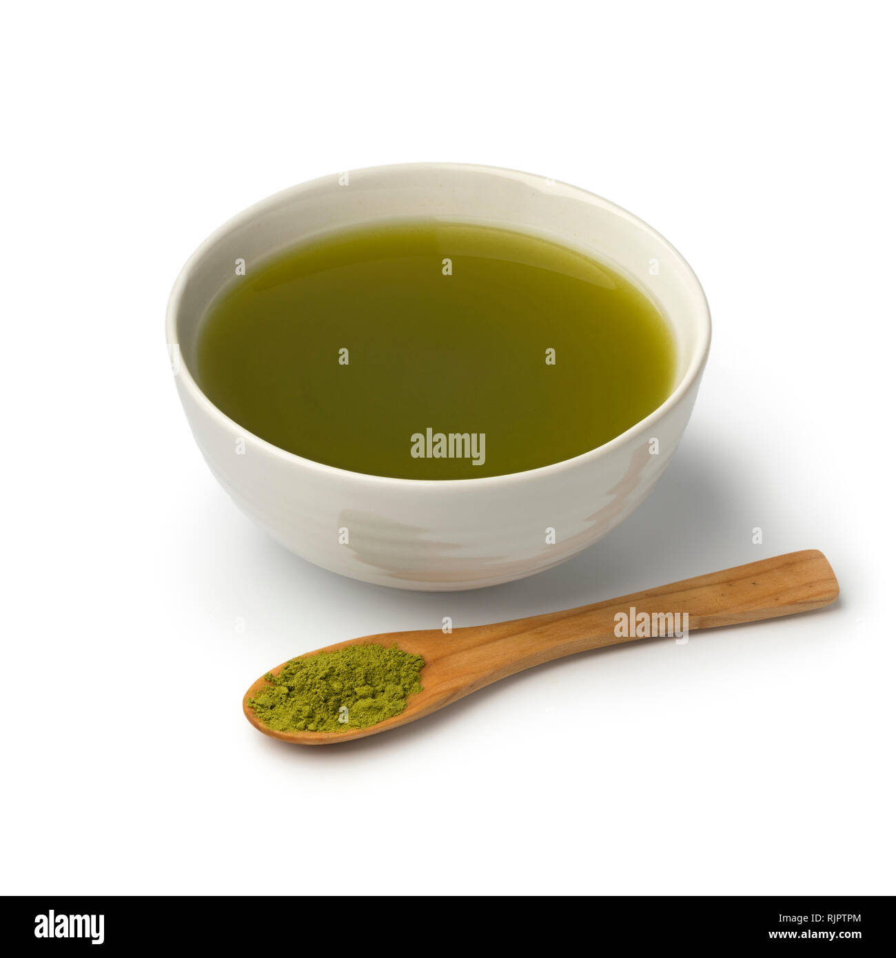 Cup of Japanese catechin green powder tea and spoon isolated on white ...