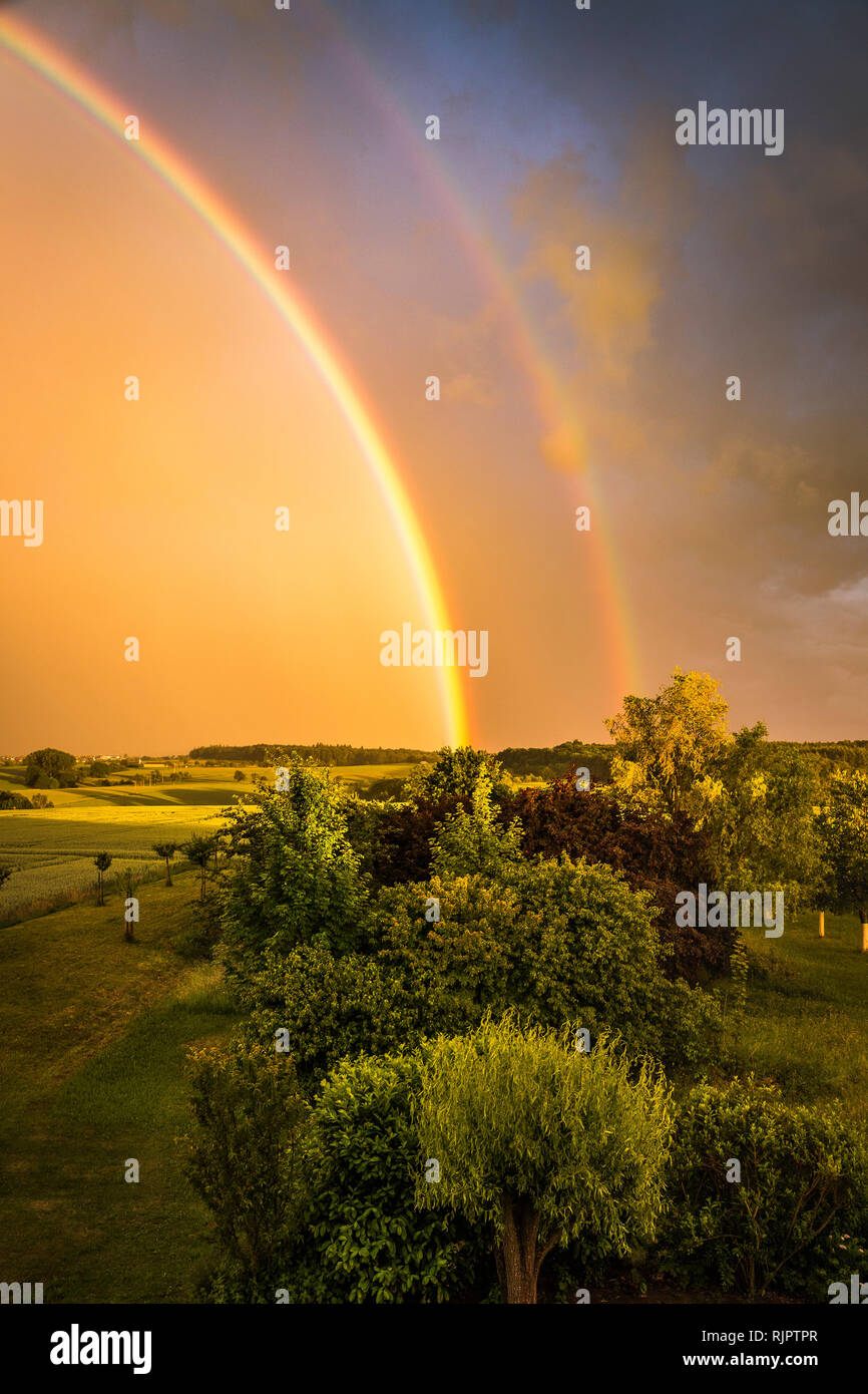 Rainbow over rural landscape hi-res stock photography and images - Alamy