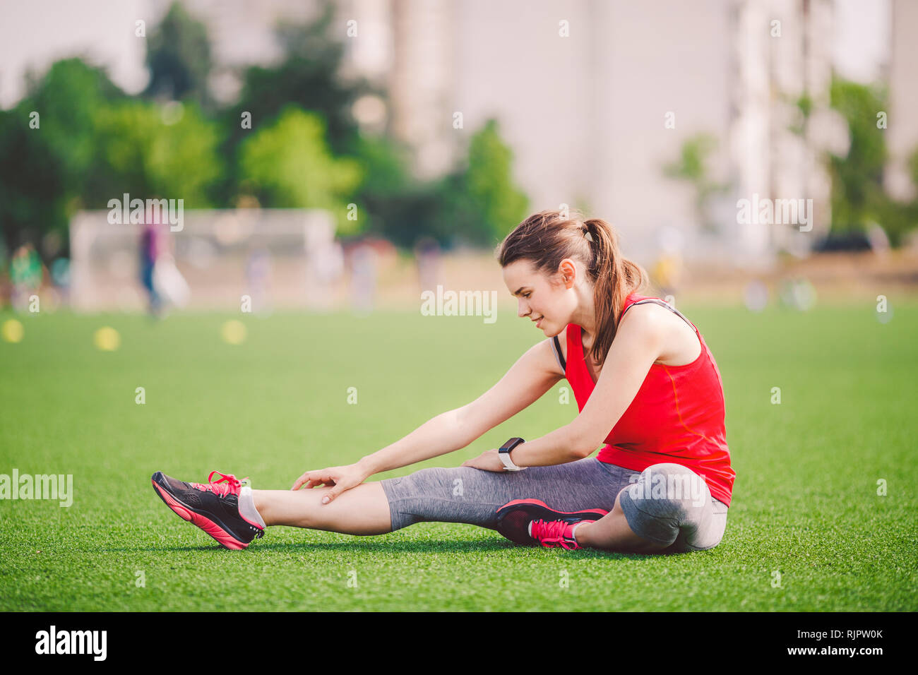 Theme sport and health. Young beautiful Caucasian woman sitting doing ...