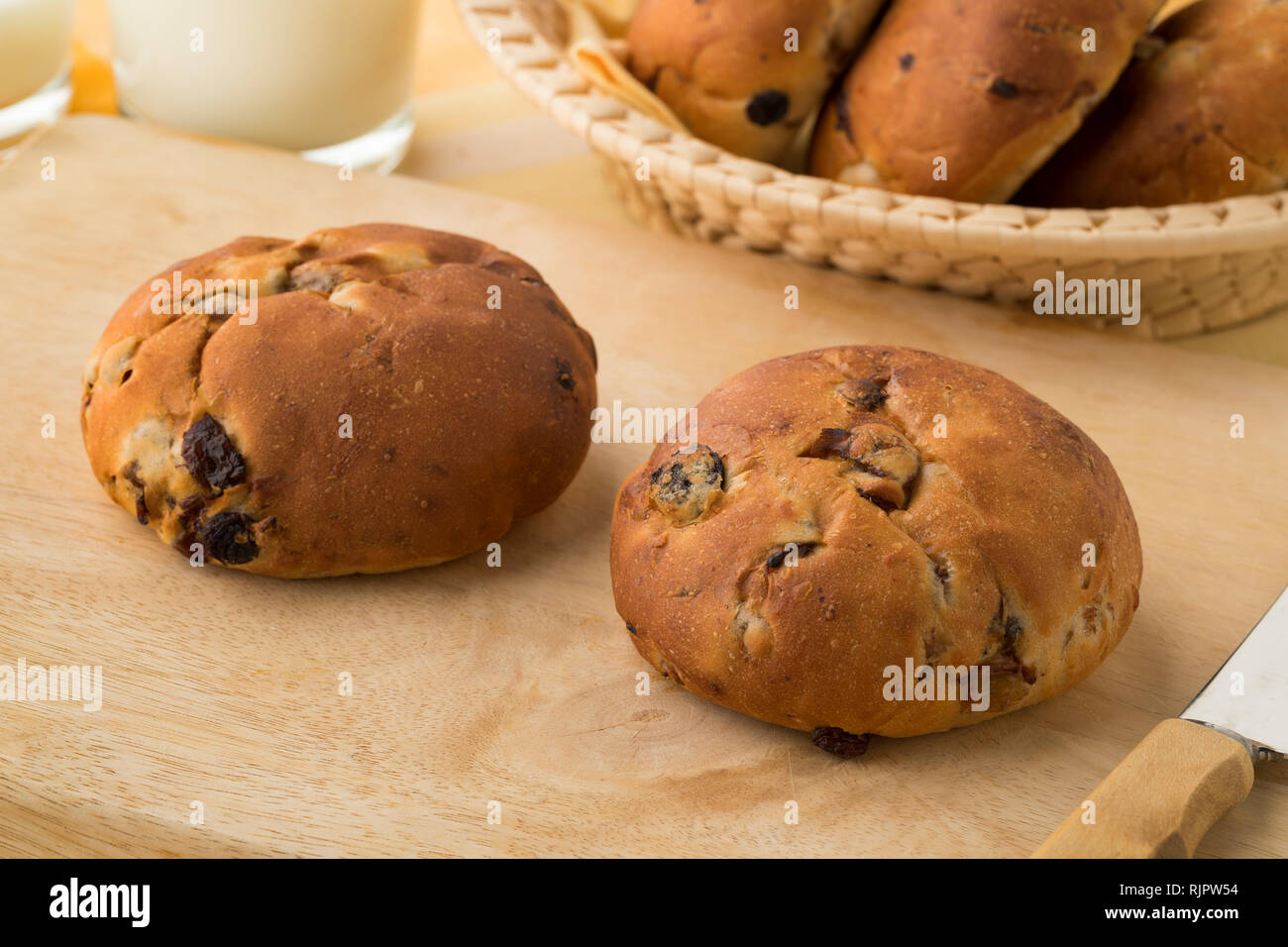 Fresh baked raisin buns for lunch Stock Photo - Alamy