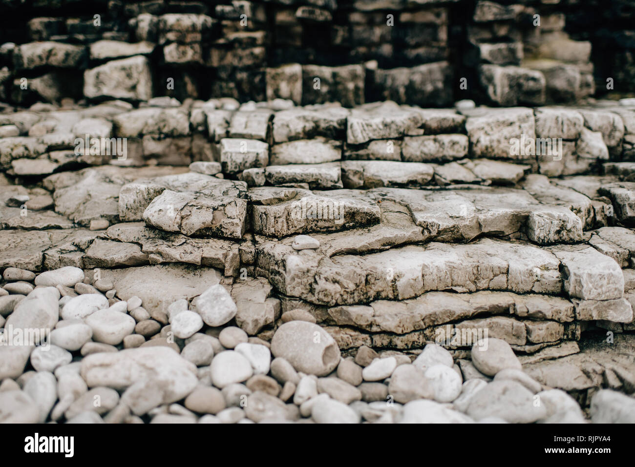 Pebbles, uneven layers of stone and rocks Stock Photo - Alamy