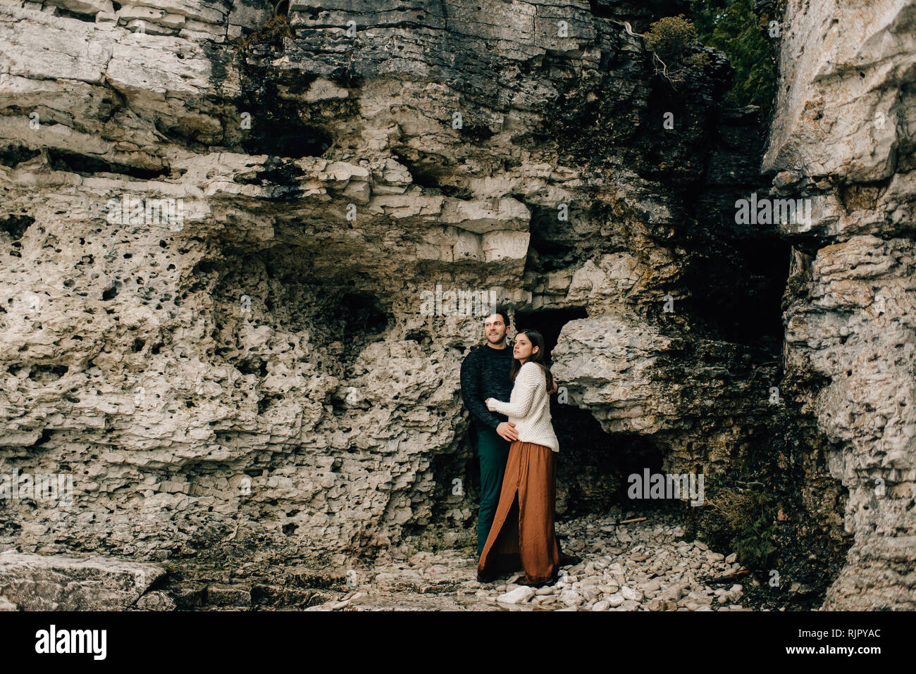 Couple hugging beside rock face, Tobermory, Canada Stock Photo - Alamy