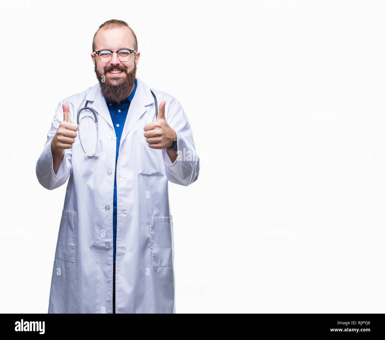 Young caucasian doctor man wearing medical white coat over isolated ...
