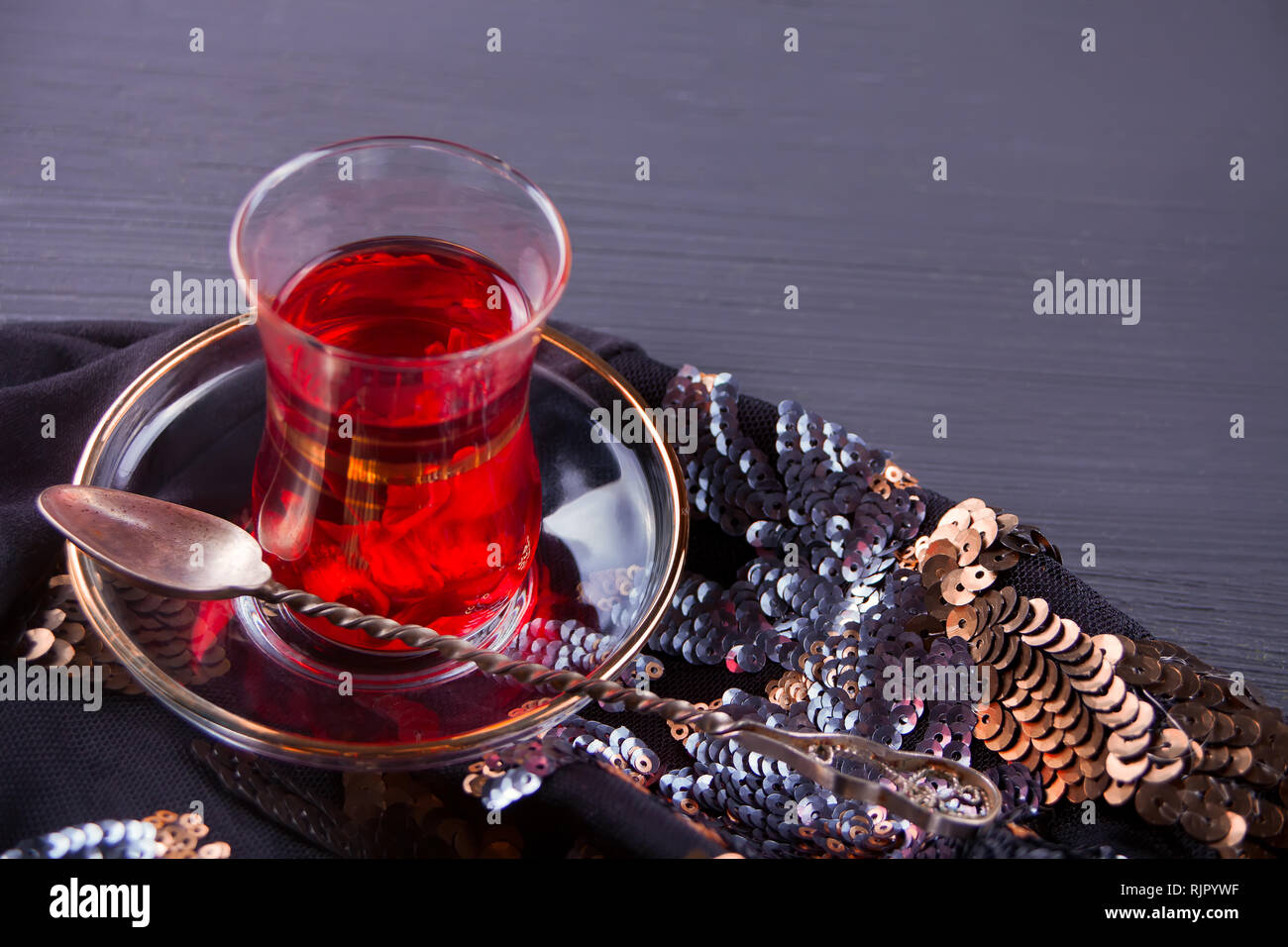 Cup of hot red karkade tea on the black background Stock Photo - Alamy