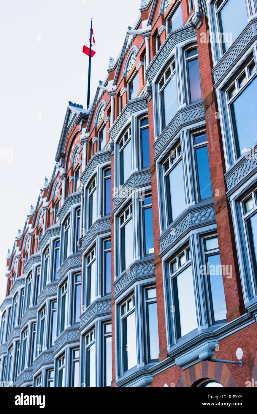 Ottawa, Ontario, Canada, November 2018 - Building facade with Red brick and windows in downtown ...