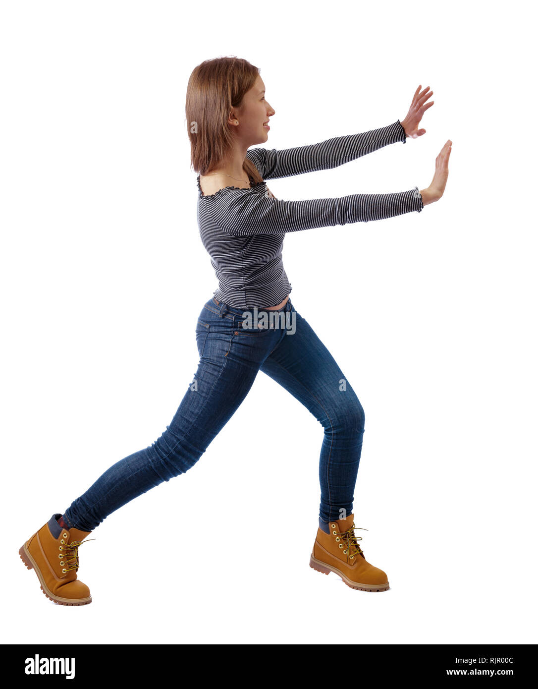 back view of woman pushes wall. Isolated over white background. Rear ...