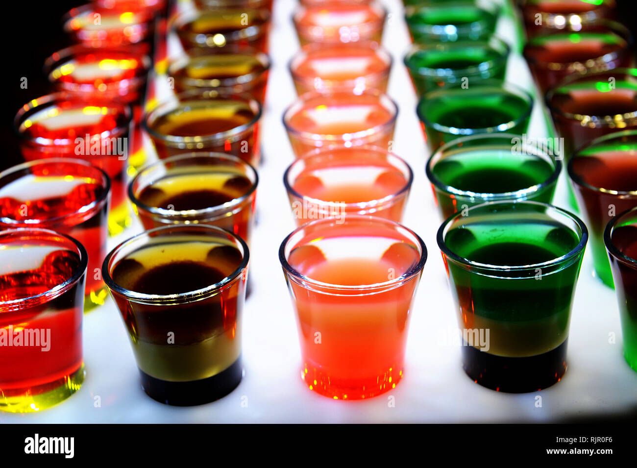 Variation of hard alcoholic shots served on bar counter Stock Photo - Alamy