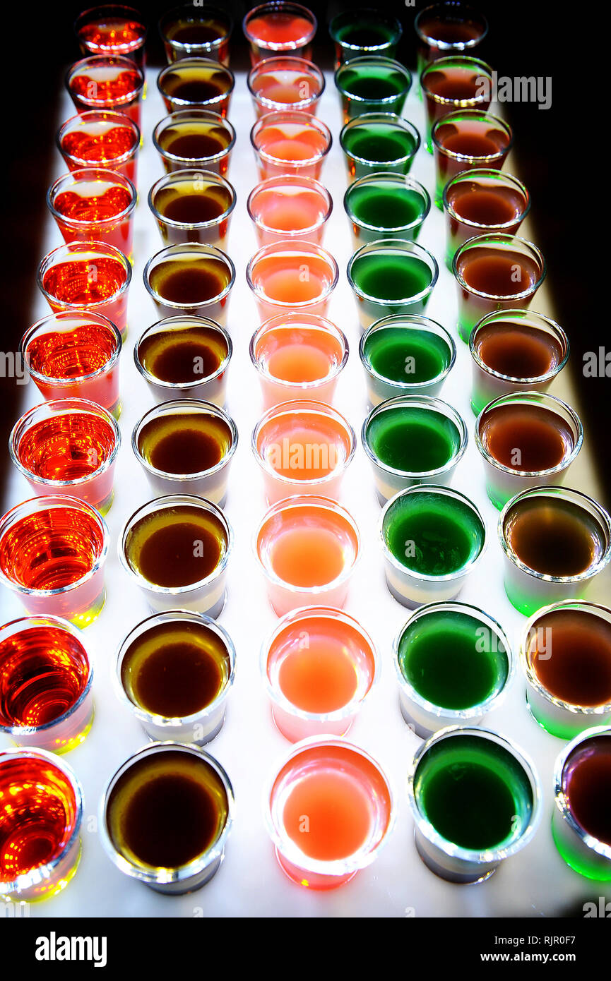 Variation of hard alcoholic shots served on bar counter Stock Photo - Alamy