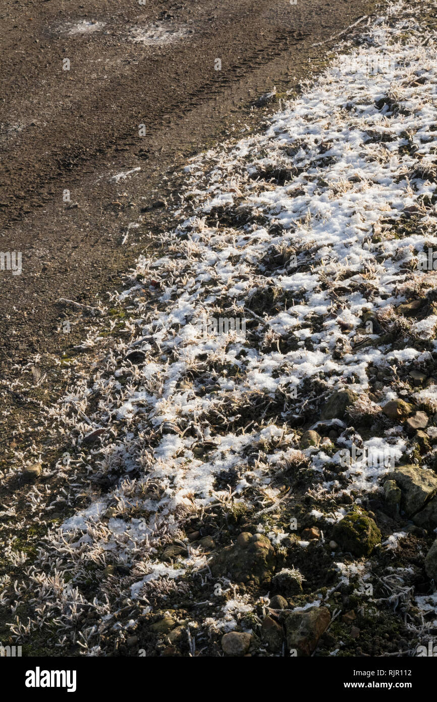 Frosty road edge, snowy verge Stock Photo - Alamy