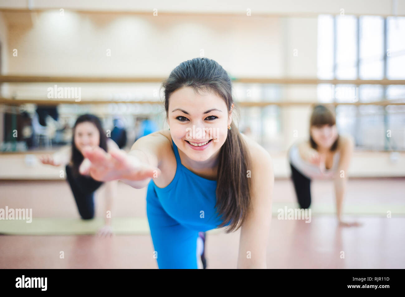 Group of people at the gym in a stretching class Stock Photo - Alamy