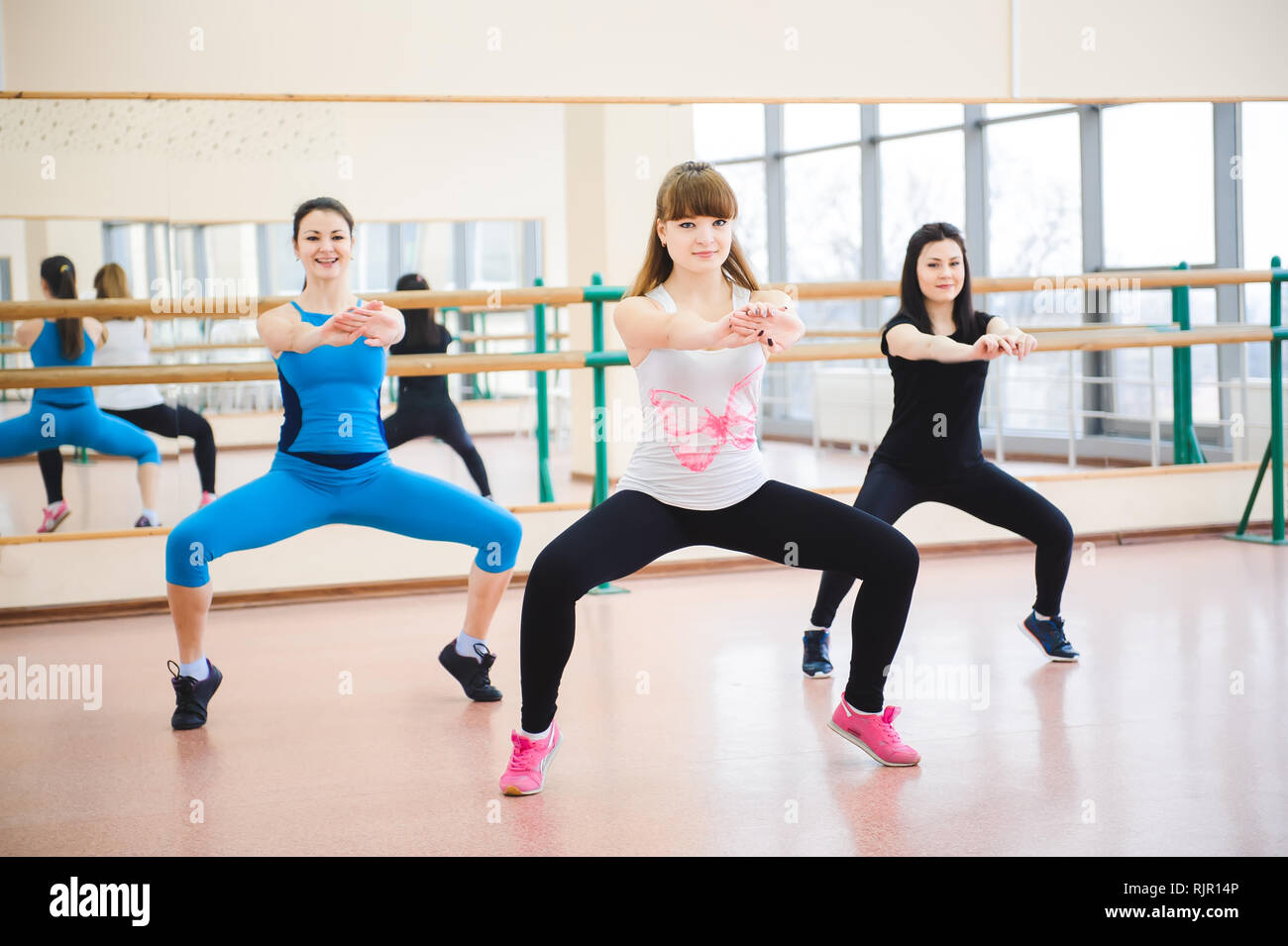 Group of people at the gym in a stretching class Stock Photo - Alamy