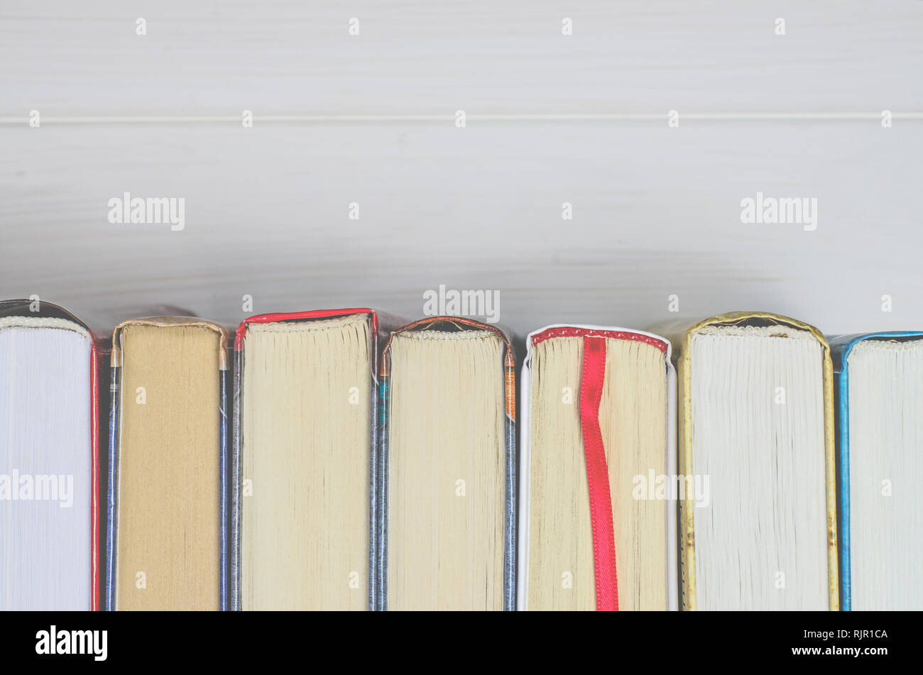 Lots of colourful thick open books stand on a white background Stock ...
