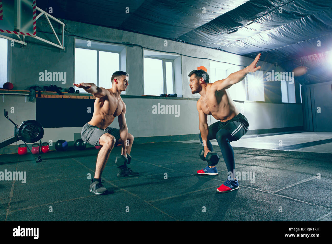 Athletic man doing exercise for arms. Photo of muscular fitness male ...