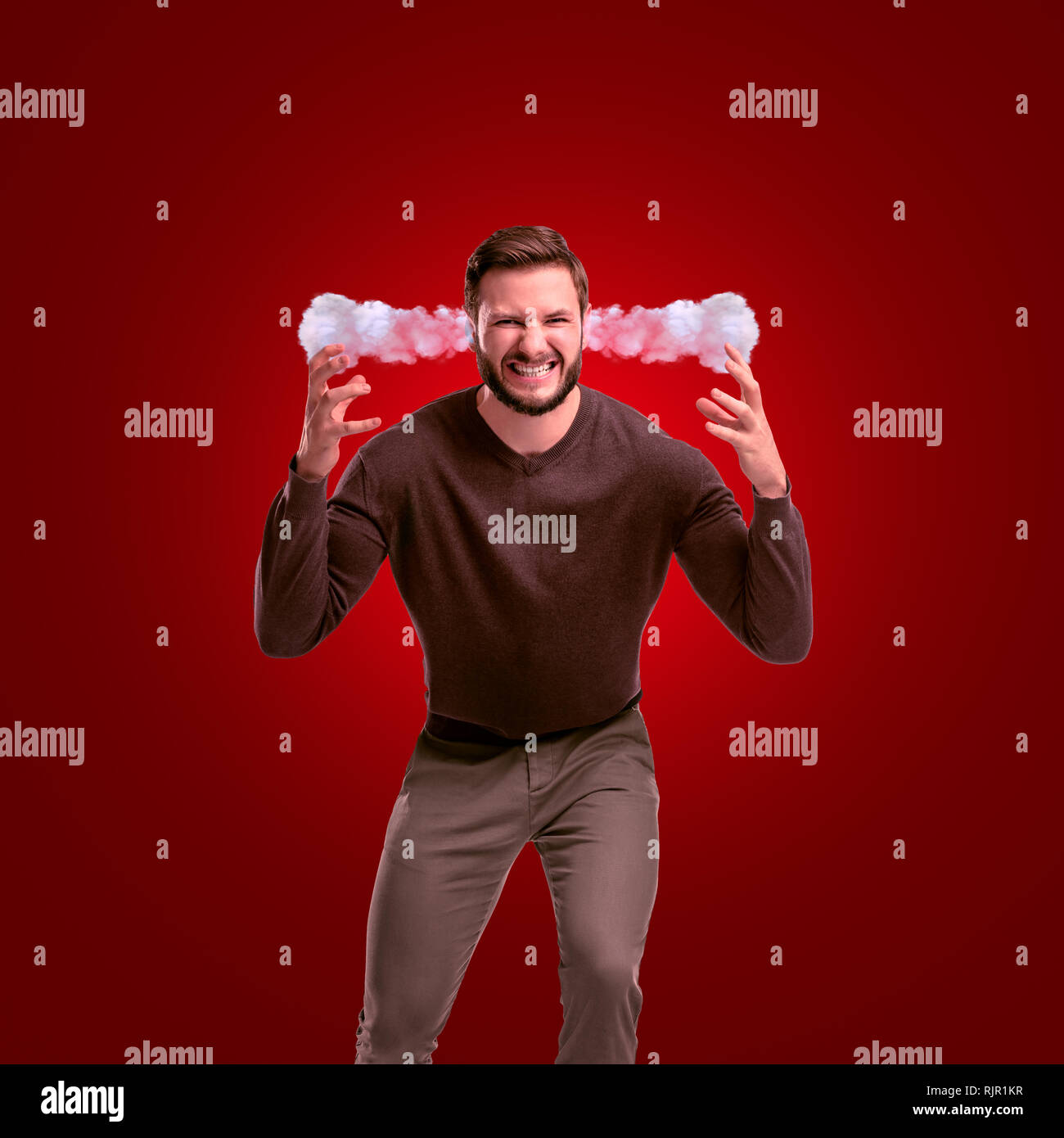 An angry man in casual outfit leaning forward with steam coming out of ...