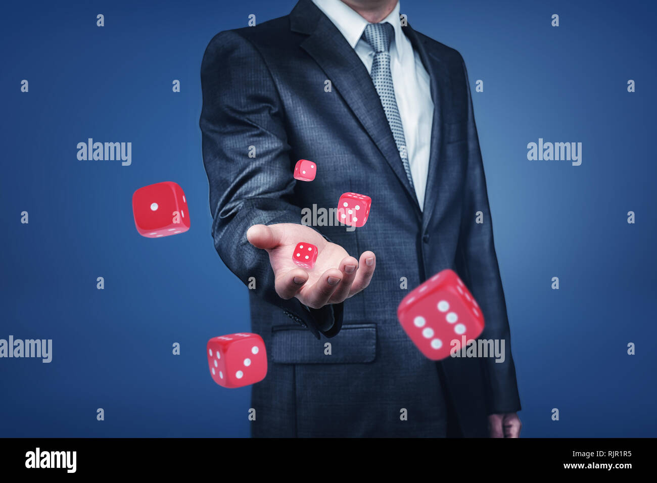 Businessman throwing dice hi-res stock photography and images - Alamy