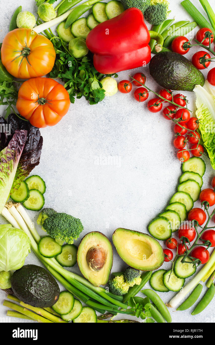 Fresh raw ingredients tomatoes cucumbers lettuce pepper avocado parsley ...