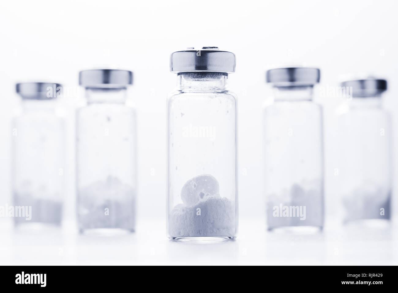 Bottles for injection with white powder on a white background Stock ...