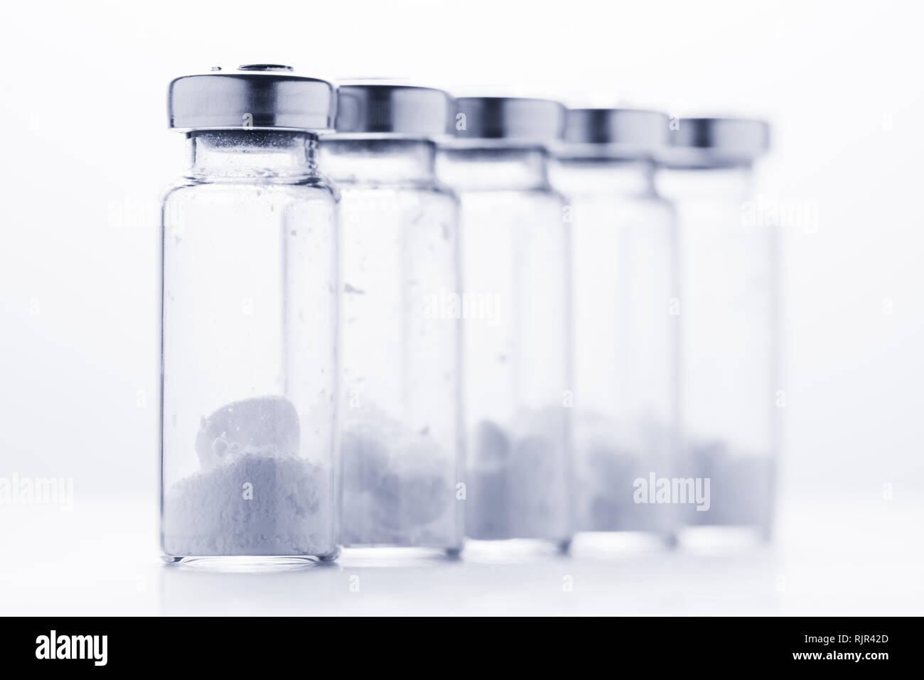 Bottles for injection with white powder on a white background Stock ...