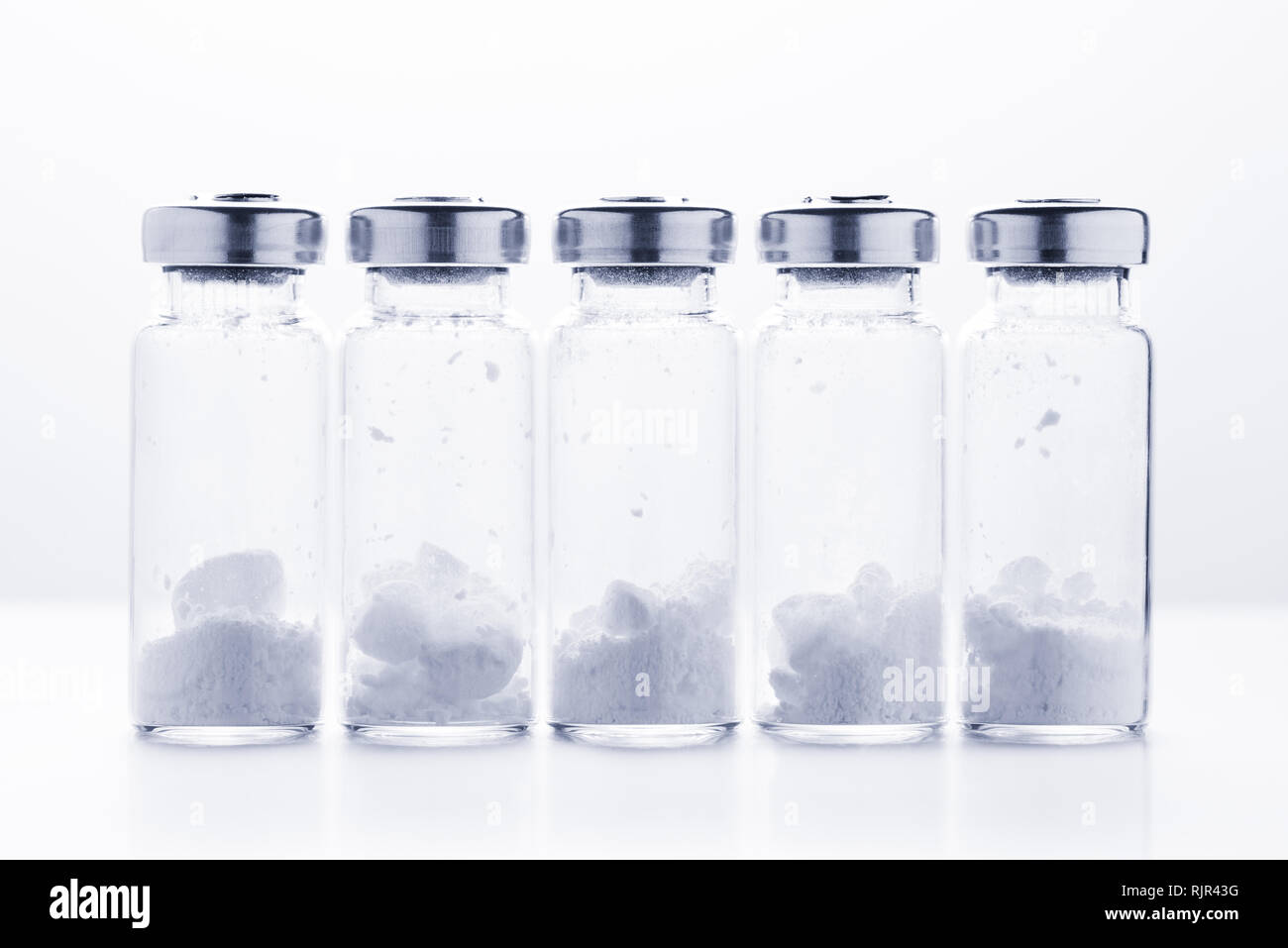 Bottles for injection with white powder on a white background Stock ...