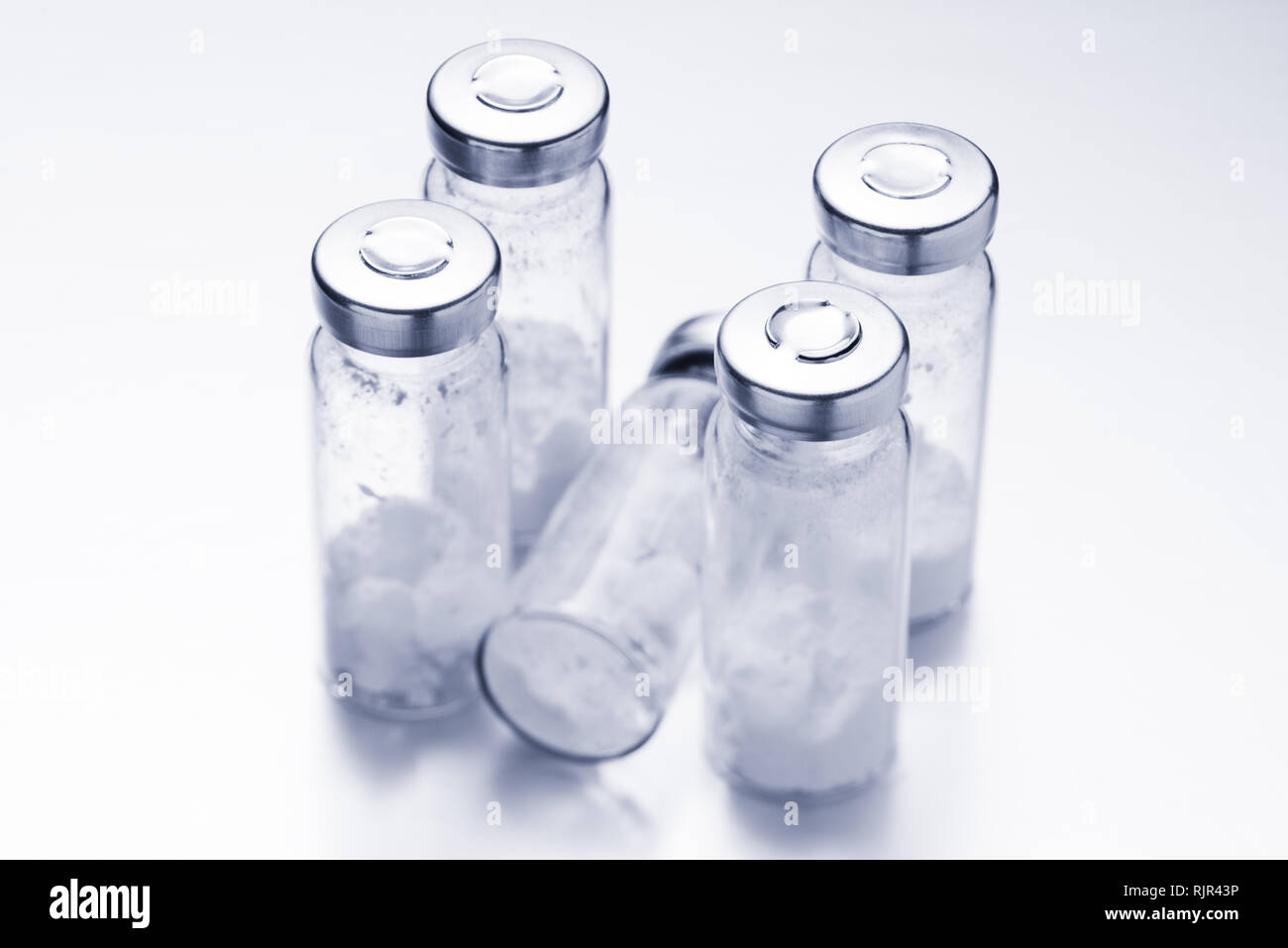 Bottles for injection with white powder on a white background Stock ...