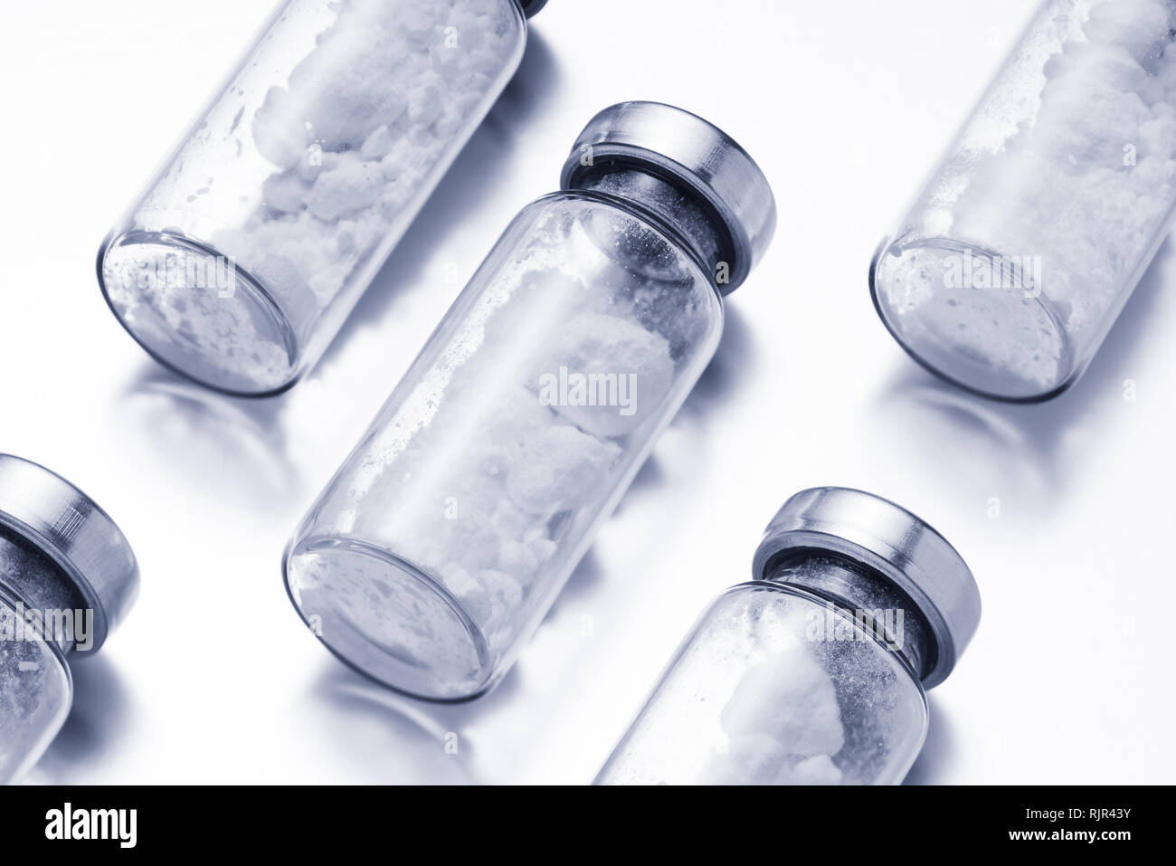 Bottles for injection with white powder on a white background Stock ...