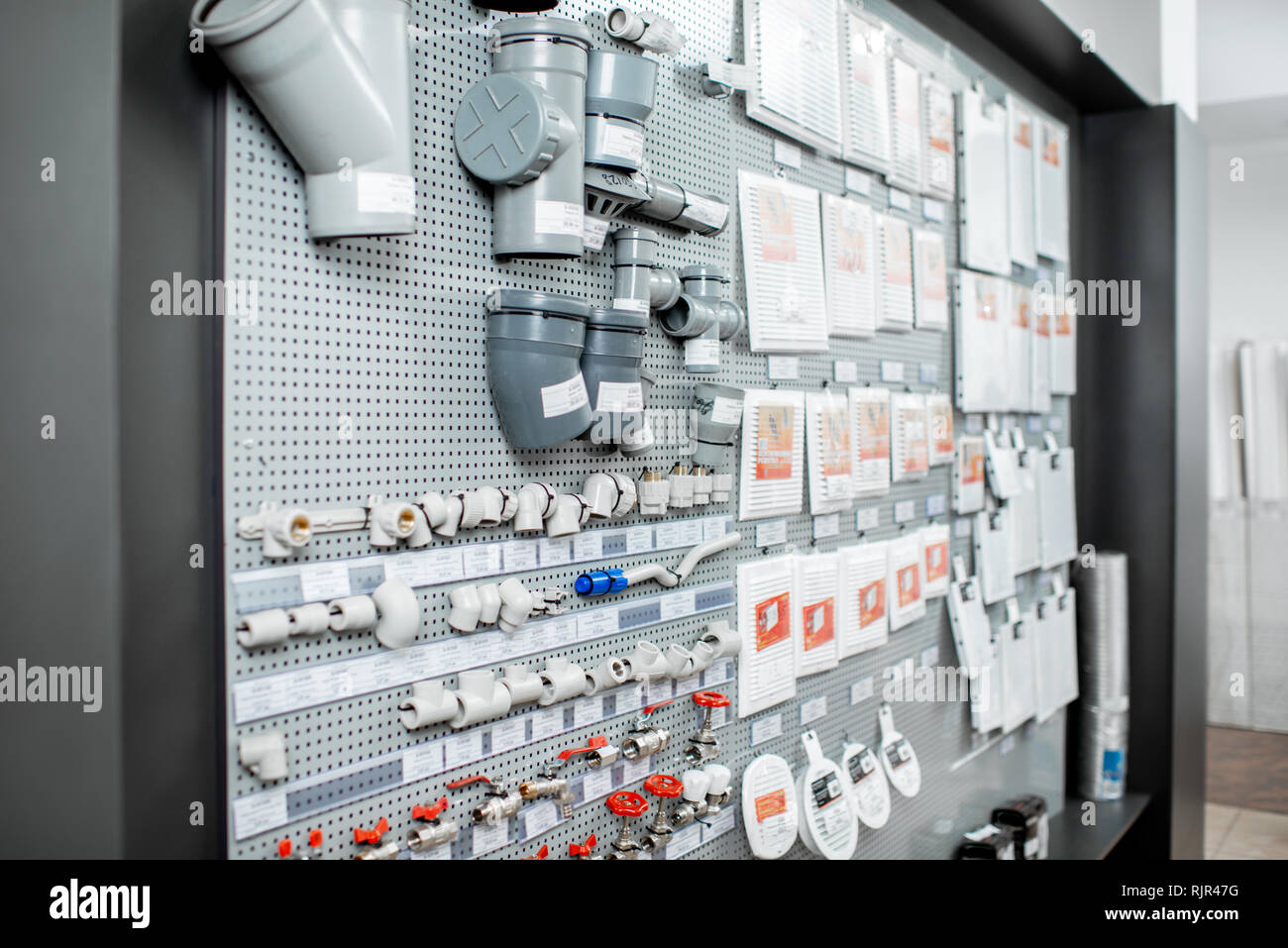 Showcase with water pipes and pipe joints in the plumbing shop Stock ...