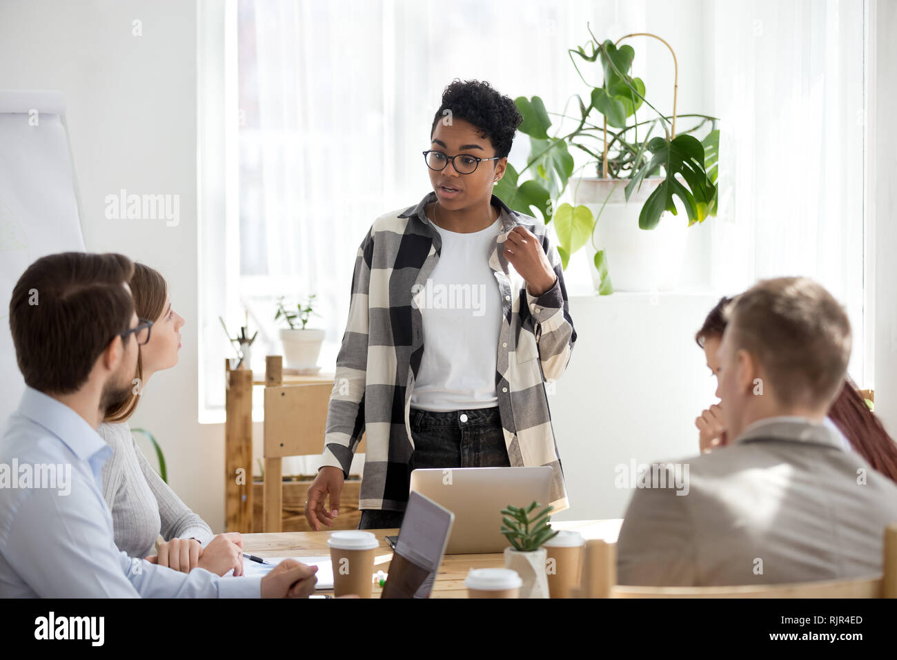 African manager having business discussion dispute with employee at ...