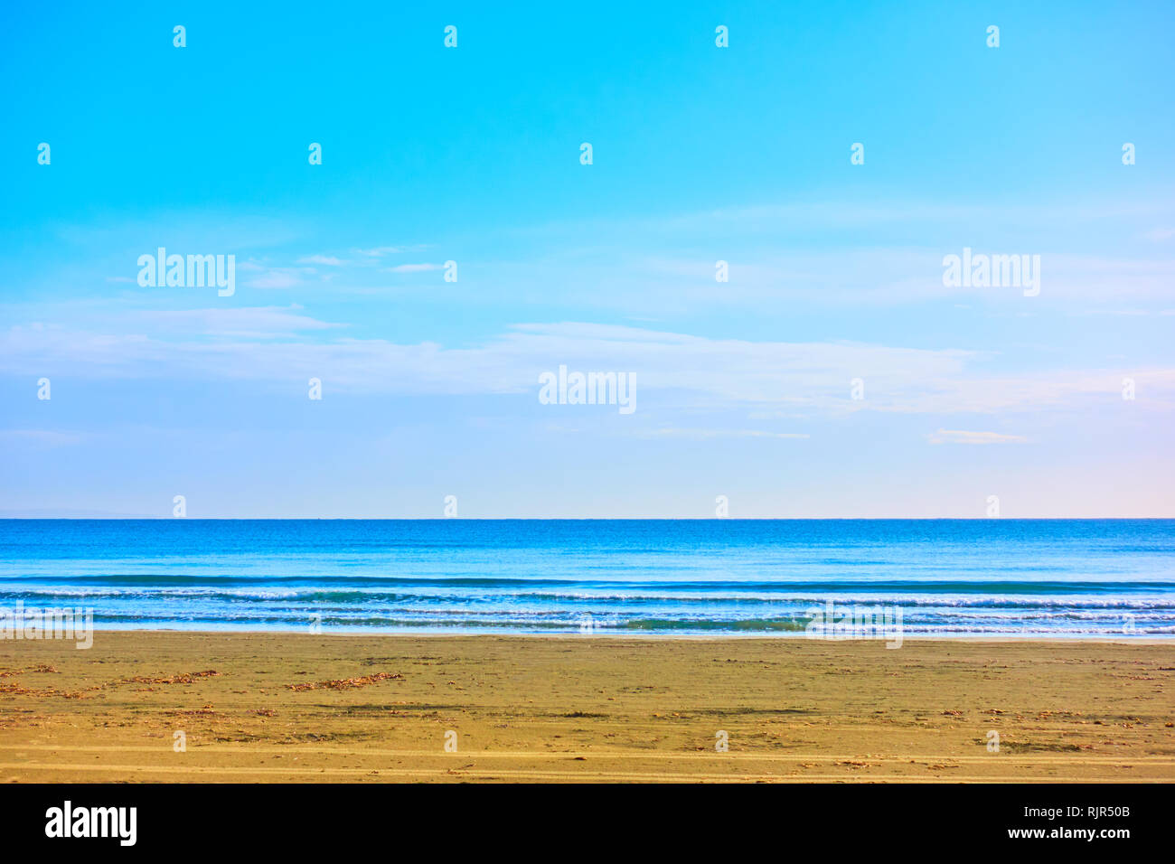 Minimalistic view of empty sandy beach and sea horizon Stock Photo - Alamy