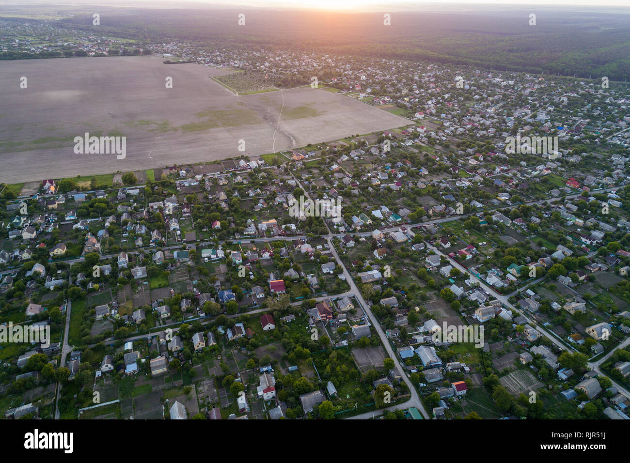 Aerial view of the fresh bright green lush countryside at sunset Stock ...