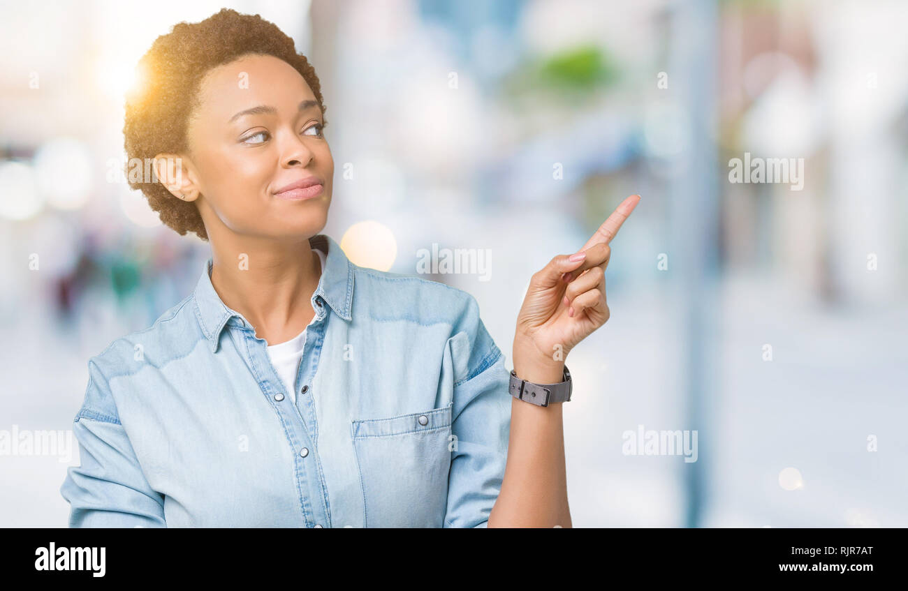 Young beautiful african american woman over isolated background ...
